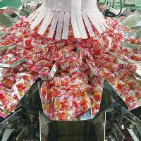 China Fully Automatic High Speed Nitrogen Vertical Form Fill Seal Pouch Snack Food Weighing Puffs Food Pellet Packing Machine for sale