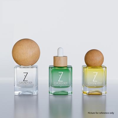 China 30ml Square Essential Oil Glass Bottle Leak Proof Bamboo Dropper Thick Bottom Cosmetic Packaging for sale