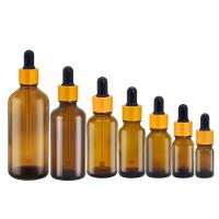 China Glass Dropper Bottles designed for cosmetic packaging with multiple sealing caps and compatible glass dropper assemblies for sale