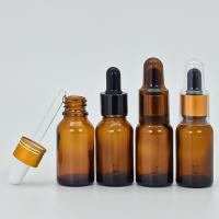 China Glass Dropper Bottles designed for cosmetic packaging with multiple sealing caps and compatible glass dropper assemblies for sale
