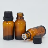 China Glass Dropper Bottles designed for cosmetic packaging with multiple sealing caps and compatible glass dropper assemblies for sale