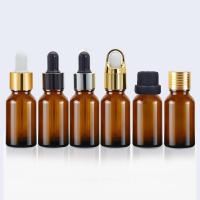 China Glass Dropper Bottles designed for cosmetic packaging with multiple sealing caps and compatible glass dropper assemblies for sale