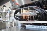 China 15-Color Cosmetics Filling Machine with 1200-1500pcs/Hour Capacity and ±0.1ml Precision for sale
