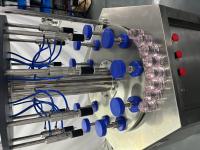 China Semi-automatic perfume rotary filling machine for sale