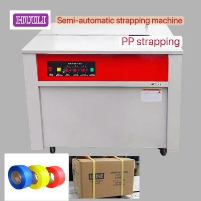 China 9mm-15mm Width Strap Semi Automatic Box Strapping Machine Flip Up Desktop Design for sale