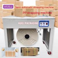 China Semi-automatic strapping machine 9-15mm PP strapping packaging equipment DC motor controlled for sale