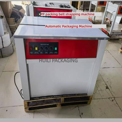 China Flexible semi Fully automatic strapping machine PP strapping high-speed packaging machine for sale