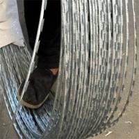 China Galvanized Concertina Razor Wire Cross Coil Double Loops for sale
