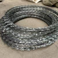 China Galvanized Concertina Razor Wire Cross Coil Double Loops for sale