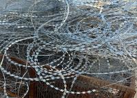 China Excellent Flat Wrap Razor Barbed Wire For Government Buildings for sale