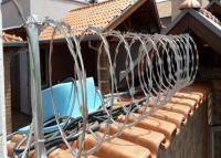 China Plastic Coated Razor Barbed Wire Flat Wrap Wire For Security Fence for sale