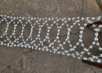 China Strong Defensive Galvanized Razor barbed wire Roll for Secure Boundaries for sale