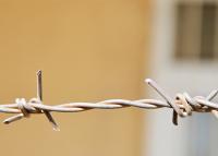 China Use Of Prison Walls Double Twisted Hot Dipped Galvanized Barbed Wire Coils for sale