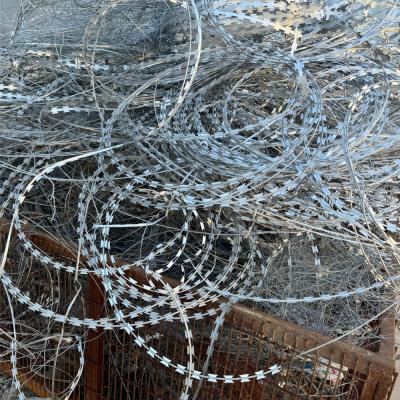 China Galvanized Bto-22 Razor Wire Fence Stretched Ribbon Barbed Wire Coils for Farm/Fence for sale