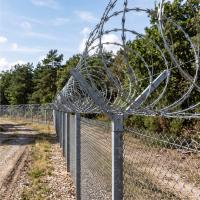 China Galvanized Concertina Razor Wire Cross Type BTO22 CBT65 Security Barbed Wire Fence Topper for sale