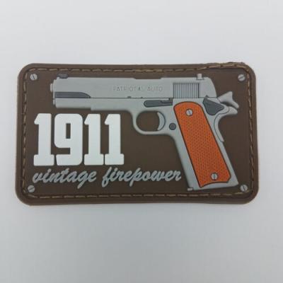 China Custom 3D PVC Colt 1911 Pistol Hook and Loop Patch Tactical Military Badge for sale