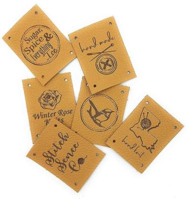 China Custom PU Leather Labels Hot Stamping Logo Felt Backing 0.5-2mm for Jeans Hats for sale