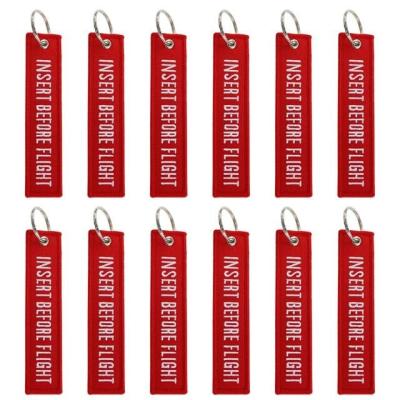 China Small ODM Flight Tag Keychain Custom Portable Red Embroidered Bulk Packaging for sale