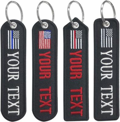China Custom Embroidered Remove Before Flight Keychain 130x30mm Nylon Promotional Gift for sale