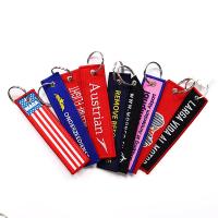 China Creative Durable Custom Logo Keychain Double Sided Woven Mark Embroidered Keychain for sale