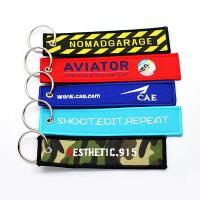 China Custom Embroidered Keychain 130x30mm Cotton Fabric Key Ring with Logo for sale