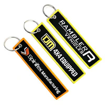 China Custom Embroidered Keychain 130x30mm Cotton Fabric Key Ring with Logo for sale