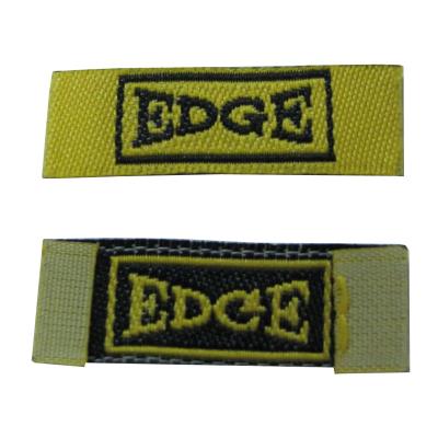 China Custom Heat Laser Cut Woven Patches Iron On Backing 50pcs Low MOQ Dry Cleanable for sale