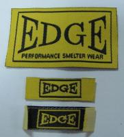 China Custom Heat Laser Cut Woven Patches Iron On Backing 50pcs Low MOQ Dry Cleanable for sale