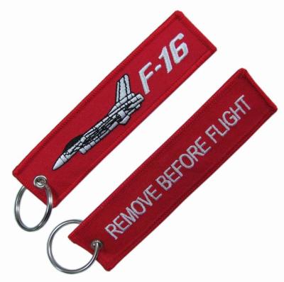 China Custom Embroidered Twill Keychain Remove Before Flight Key Tag 130x30mm for sale