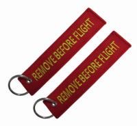 China Custom Embroidered Fabric Keychain 130x30mm Remove Before Flight 75% Embroidery Metallic Thread for sale