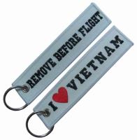 China Custom Remove Before Flight Embroidered Keychain 130x30mm with Eyelet Ring for sale