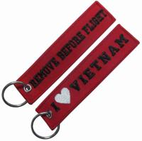 China Custom Remove Before Flight Embroidered Keychain 130x30mm with Eyelet Ring for sale