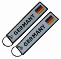 China Custom 12C Pantone Remove Before Flight Embroidery Keychain 130x30mm Merrow Border for sale