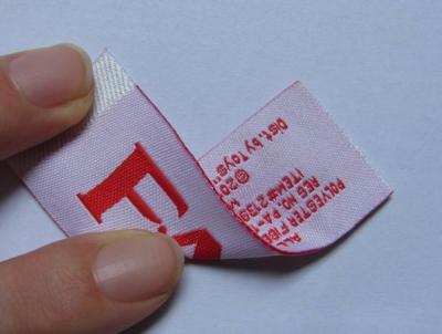 China Custom No Shrinking PMS Woven Iron Labels Heat Cut Border 100 PCS Garment Tags for sale
