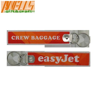 China Custom Woven Keyring with Pilot Aviation Airplane Logo Merrowed Border 130x30mm for sale