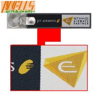 China Custom Woven Keyring with Pilot Aviation Airplane Logo Merrowed Border 130x30mm for sale