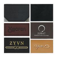 China Custom Faux Leather Labels PMS Color Vegan Merrow Border for Clothing Handbag Tagger 100 PCS for sale