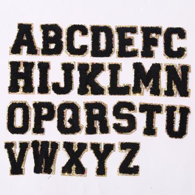 China Custom A-Z Chenille Letter Patches Gold Glitter Border Iron On Embroidered Alphabet Patches 3mm Thickness for sale