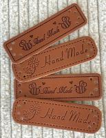 China Custom PU Leather Tags Embossed Debossed Logo 0.5-2mm for Bags Shoes Clothing for sale
