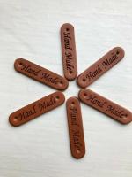 China Custom PU Leather Labels Sew On Washable Dry Cleanable Pantone Color 100pcs MOQ for sale