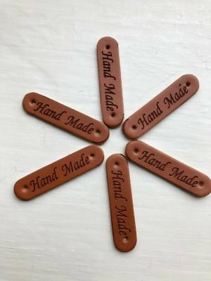 China Custom PU Leather Labels Sew On Washable Dry Cleanable Pantone Color 100pcs MOQ for sale
