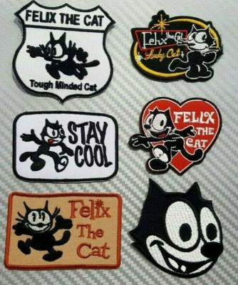 China Custom Embroidered Iron On Patch Merrow Border Twill Fabric 100mm Wide for Clothing for sale