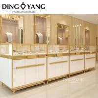 China Custom Made Fashion Golden White Retail Jewellers Display Counters , Retail Jewellery Display Counter , Fitted With LED for sale