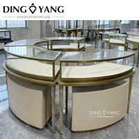 China Modern Golden Glass Stainless Steel Luxury Round Jewelry Showcase Combination Of Practicality And Beauty for sale