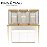 China High End Large Jewelry Display Case For Jewelry Store, Golden Hairline Stainless Steel And Ultra-Clear Tempered Glass for sale