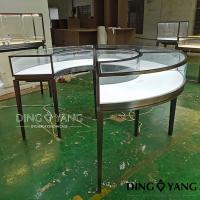 China Custom Rose Gold Curved Jewellery Display Counter Showcase for sale