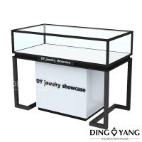 China Custom Made Shinning White Brush Gold Jewelry Table with Glass Display and Locks for sale