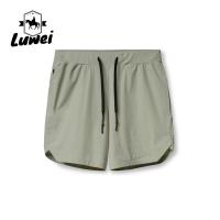 China Drawstring Men Sports Shorts Polyester Woven Plain Jogger Workout Shorts for sale