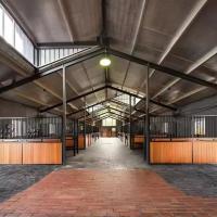 China Aluminum Alloy Window Goat Farming House Prefabricated Steel Building With Sandwich Panel Glass Wool Roof Cladding for sale