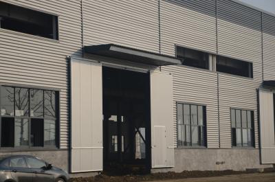 China Q235B Prefabricated Steel Frame Building System Construction for Commercial Warehouse Fast Assembly Minimal Maintenance for sale